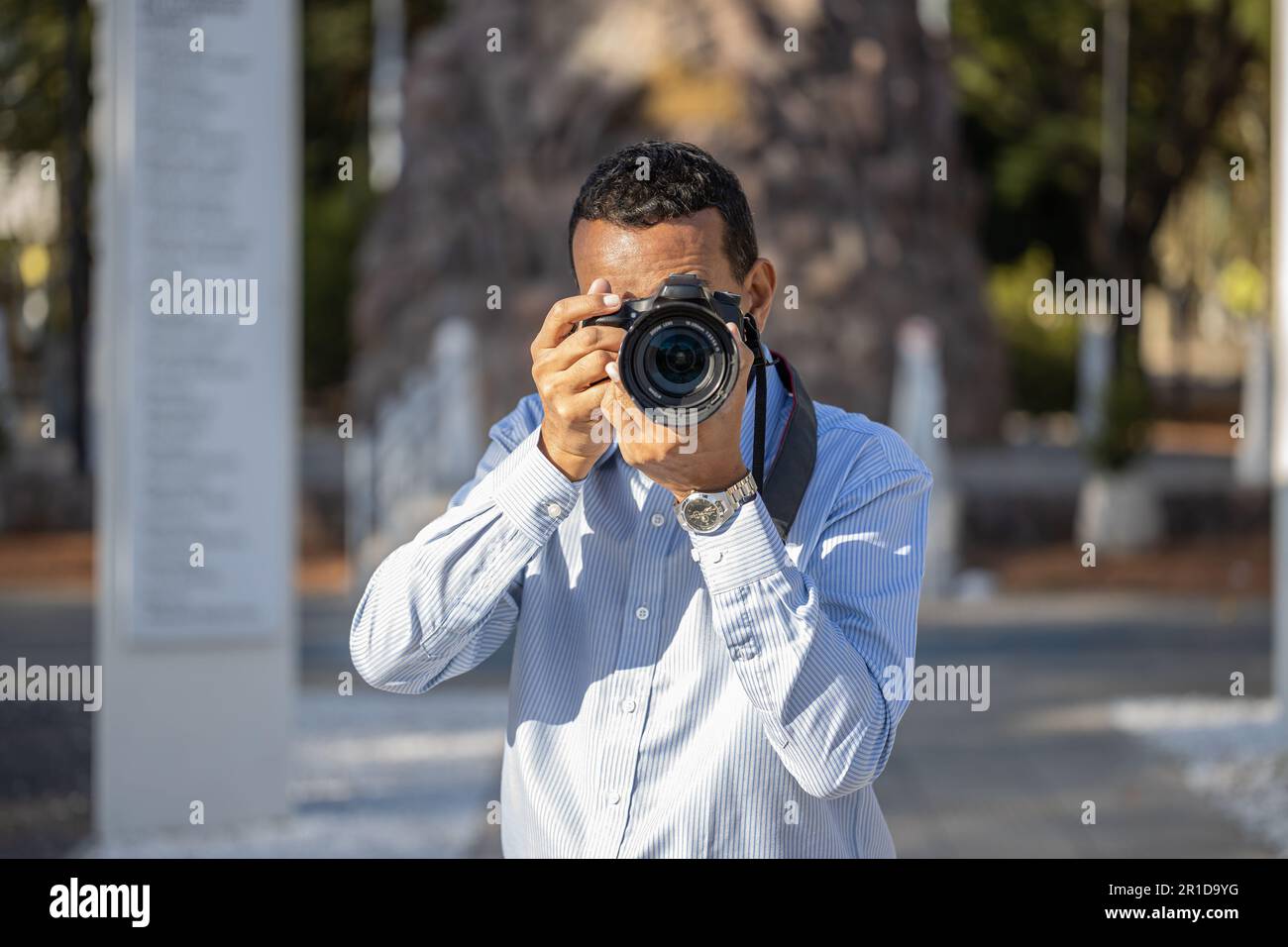 Front view of a photographer taking a picture Stock Photo - Alamy