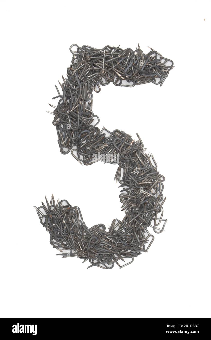 artistic number five 5 made from steel staples isolated on a white ...