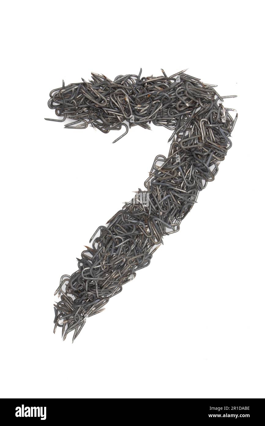 artistic number seven 7 made from steel staples isolated on a white ...