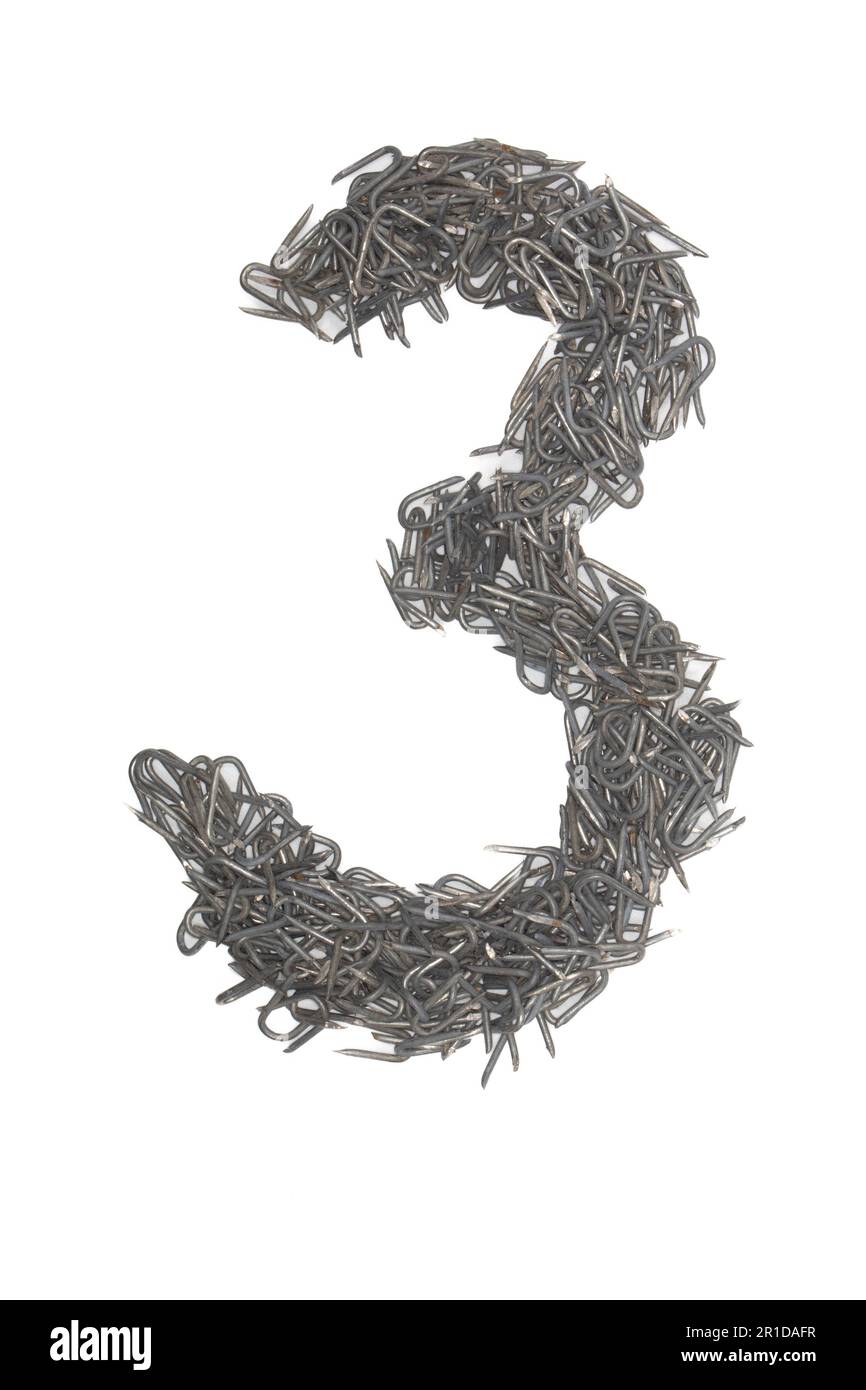 artistic number three 3 made from steel staples isolated on a white ...