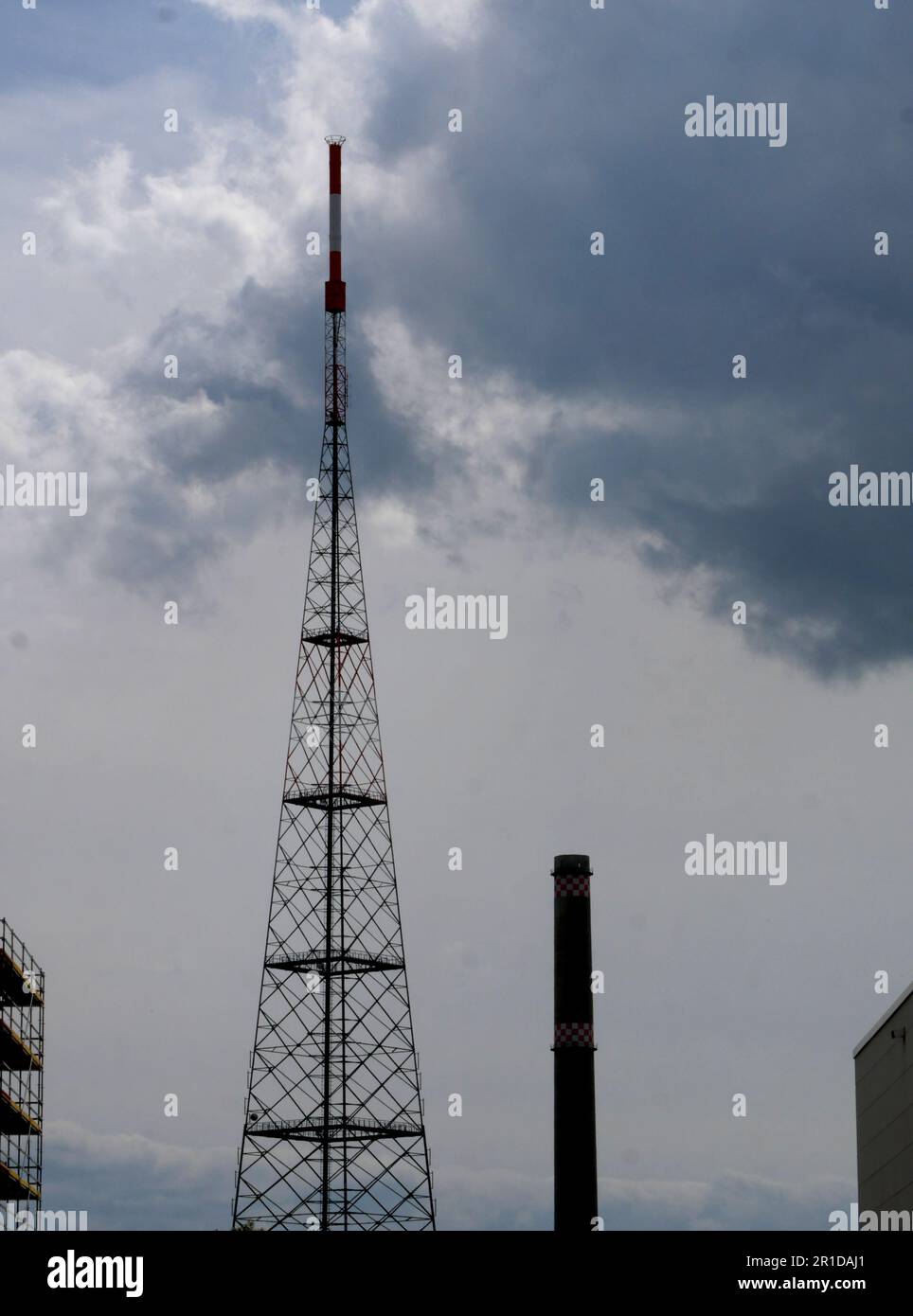 telecomunication tower close to a chimney Stock Photo - Alamy