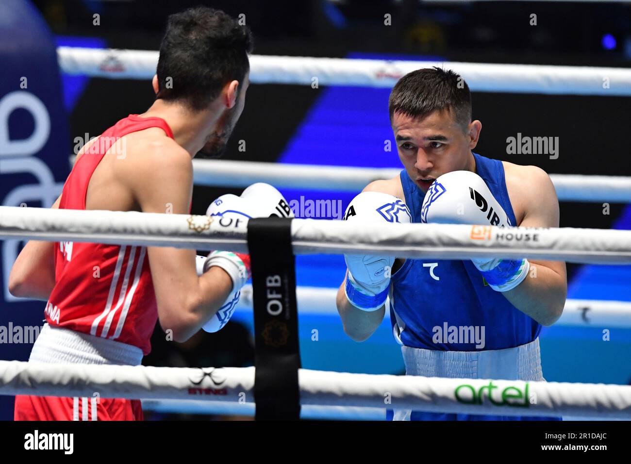 Uzbekistan's Hasanboy Dusmatov, blue, fights with France's Billal ... Uzbekistan's Hasanboy Dusmatov, blue, fights with France's Billal ...