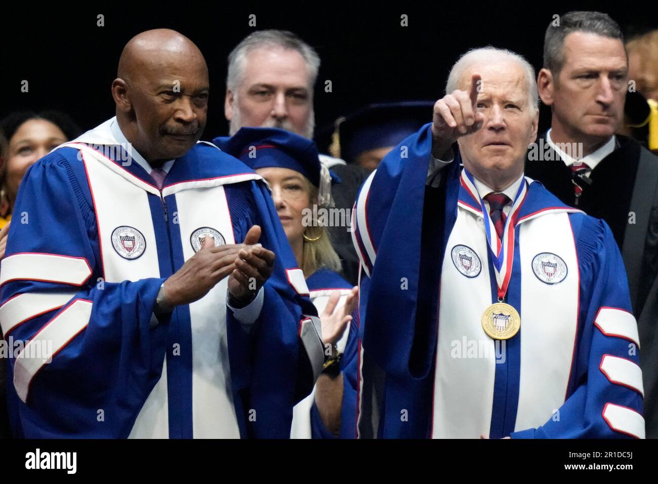 President Joe Biden points to the crowd as he arrives at Howard ...