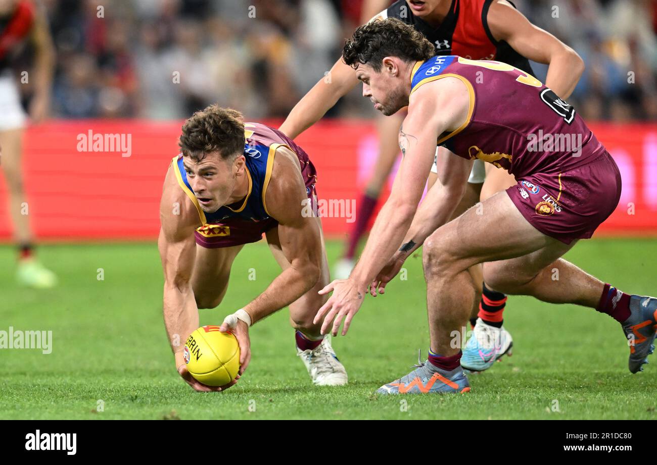Josh Dunkley (left) and Lachie Neale (right) of the Lions in action ...