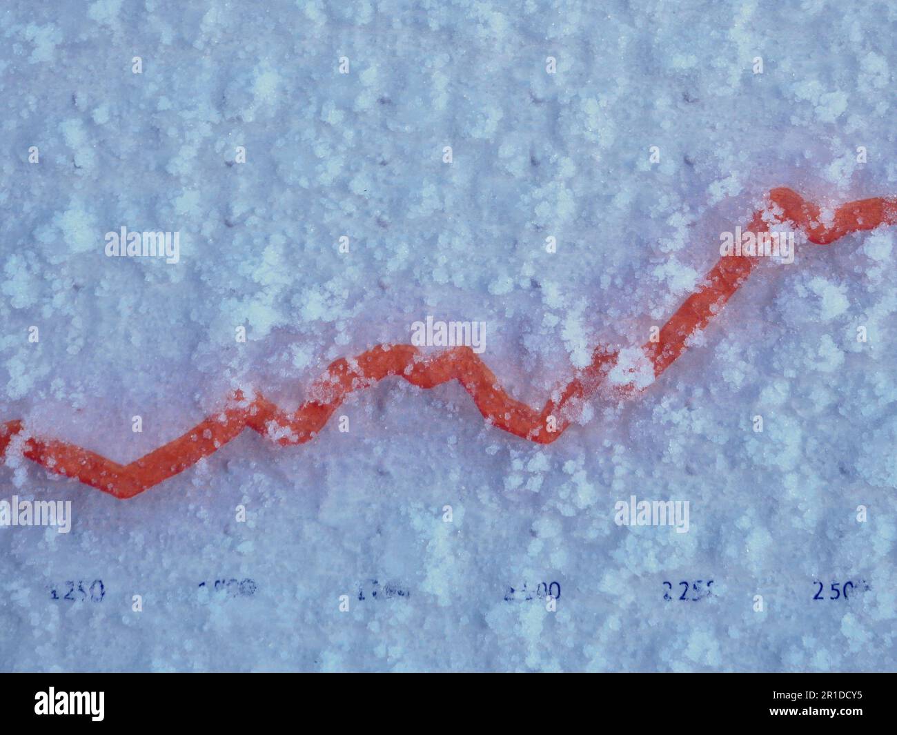 red chart line frozen with ice Stock Photo - Alamy