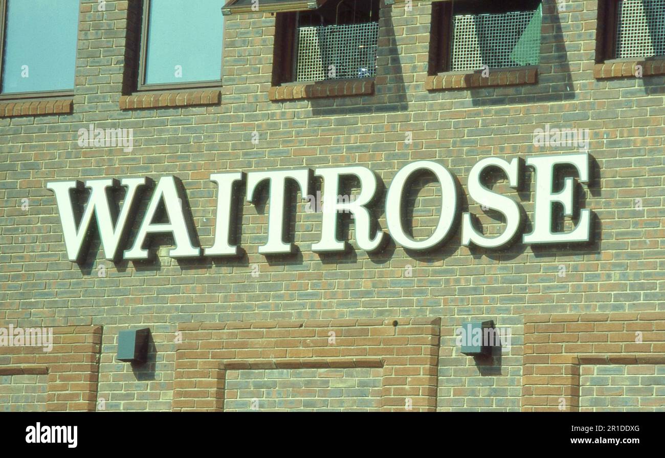 Signage outside a branch of the Waitrose supermarket chain at Tenterden ...