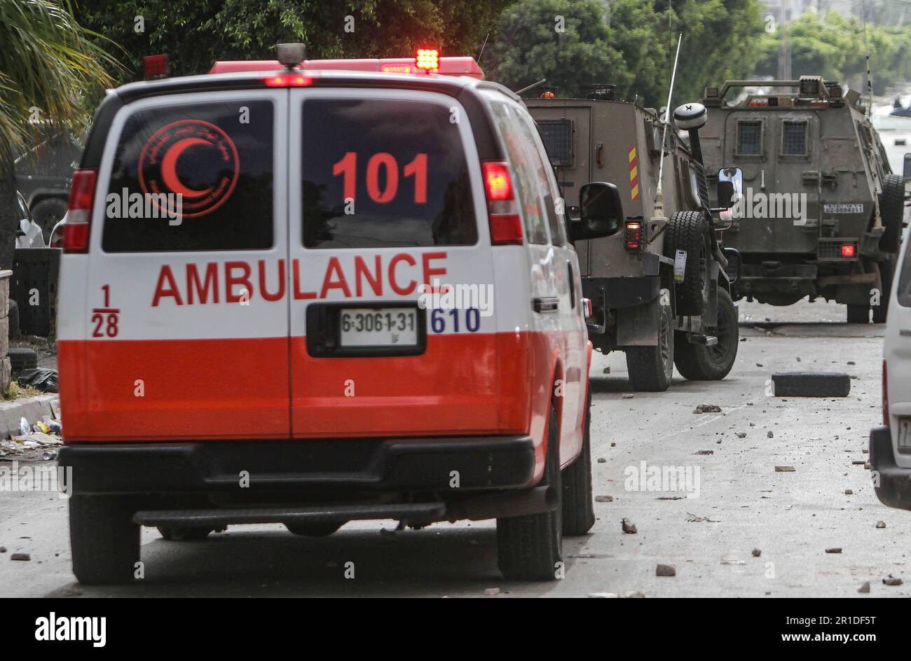 Nablus, Palestine. 13th May, 2023. Red Crescent ambulances transport ...