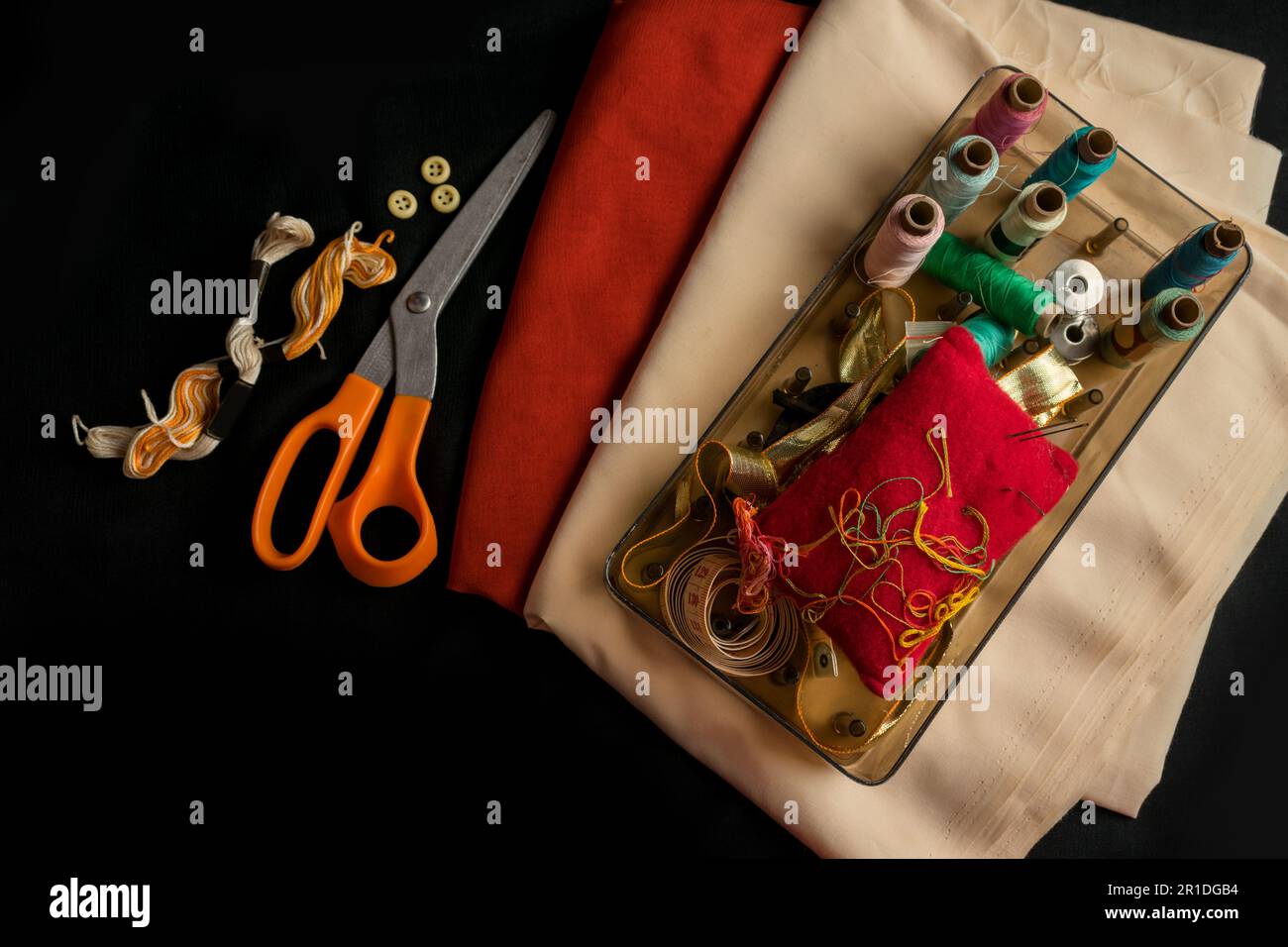 Top view aerial image of a tailor's work desk in a sewing workshop on a ...