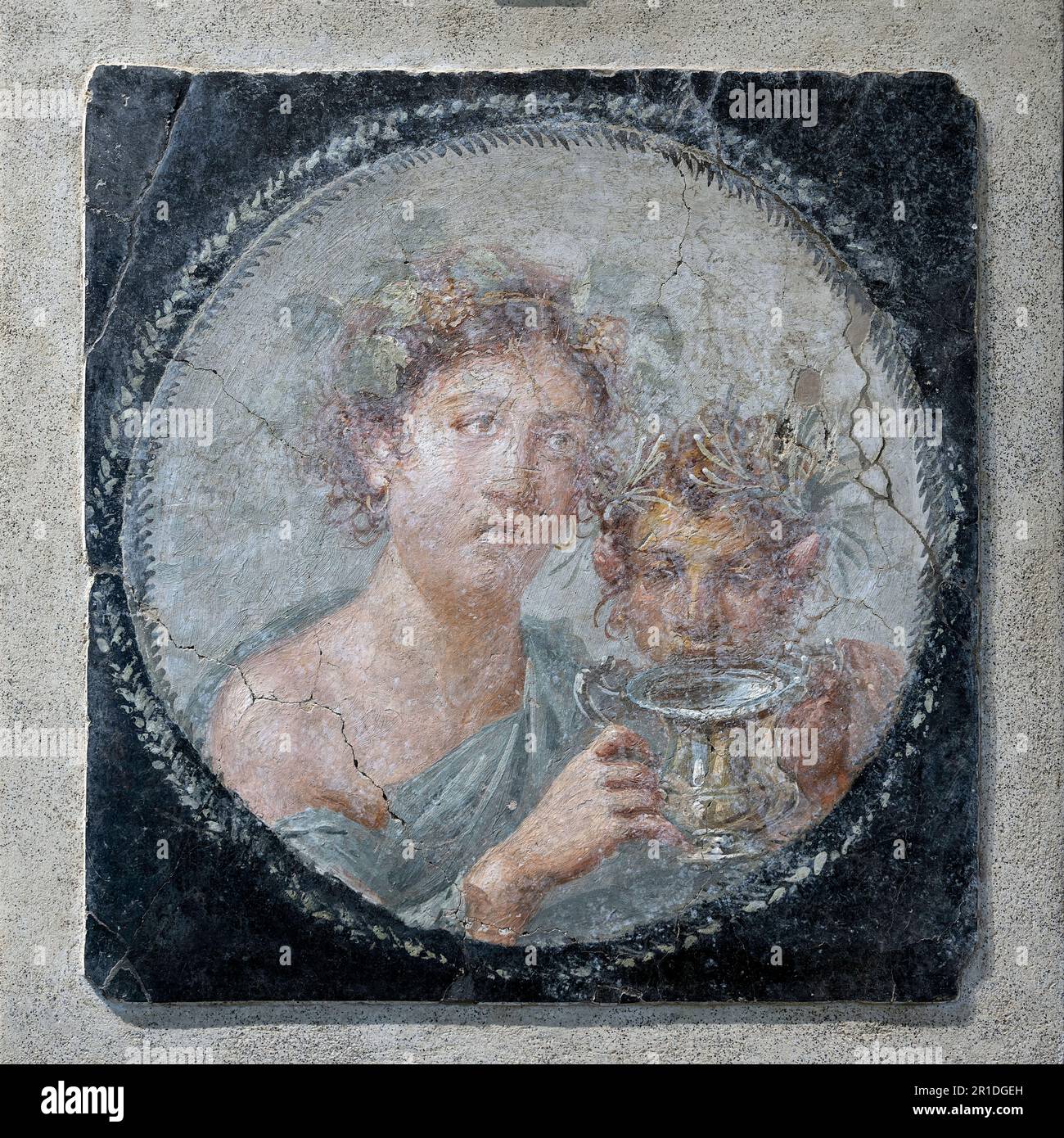 Medallion depicting Maenad and a Satyr with a silver wine cup Stock ...