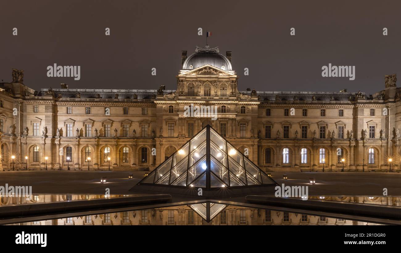 The Louvre in Paris, France. Glass Pyramids at night in the famous ...