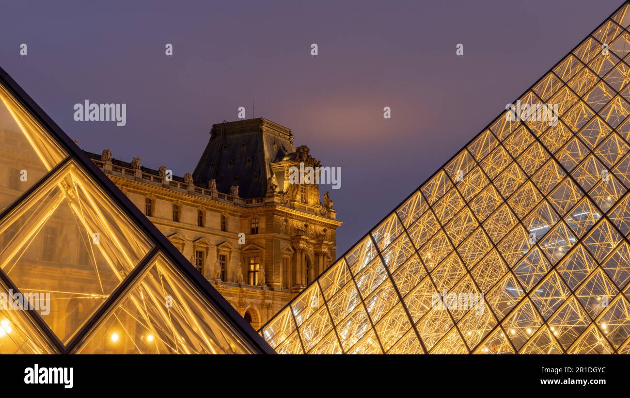 The Louvre in Paris, France. Glass Pyramids at night in the famous ...