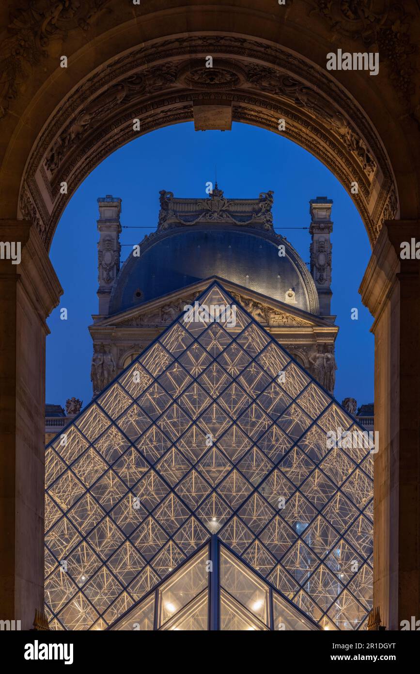 The Louvre in Paris, France. Glass Pyramids at night in the famous ...