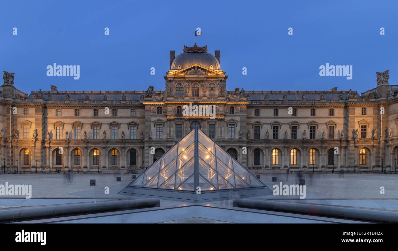 The Louvre in Paris, France. Glass Pyramids at night in the famous ...
