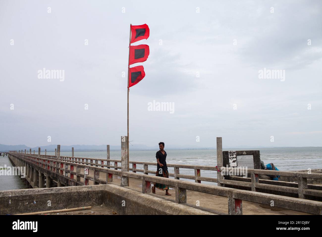 May 13, 2023, Dhaka, Dhaka, Bangladesh: People gather beside a storm ...