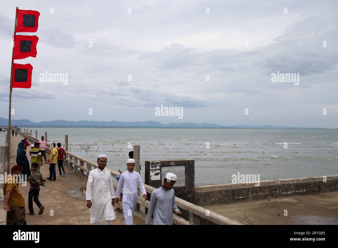 May 13, 2023, Dhaka, Dhaka, Bangladesh: People gather beside a storm ...