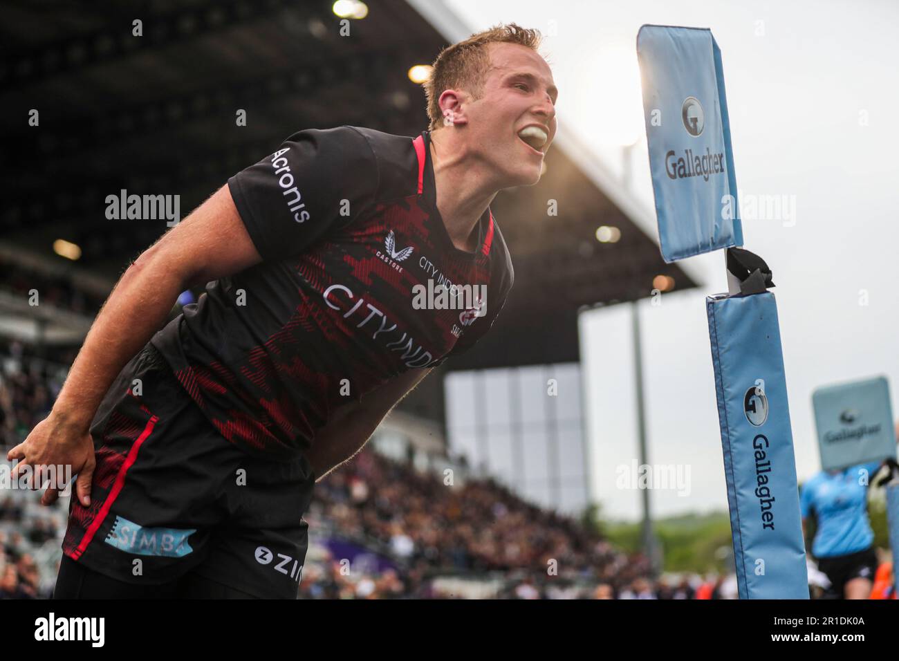 Saracens' Max Malins celebrates after scoring a try during the ...