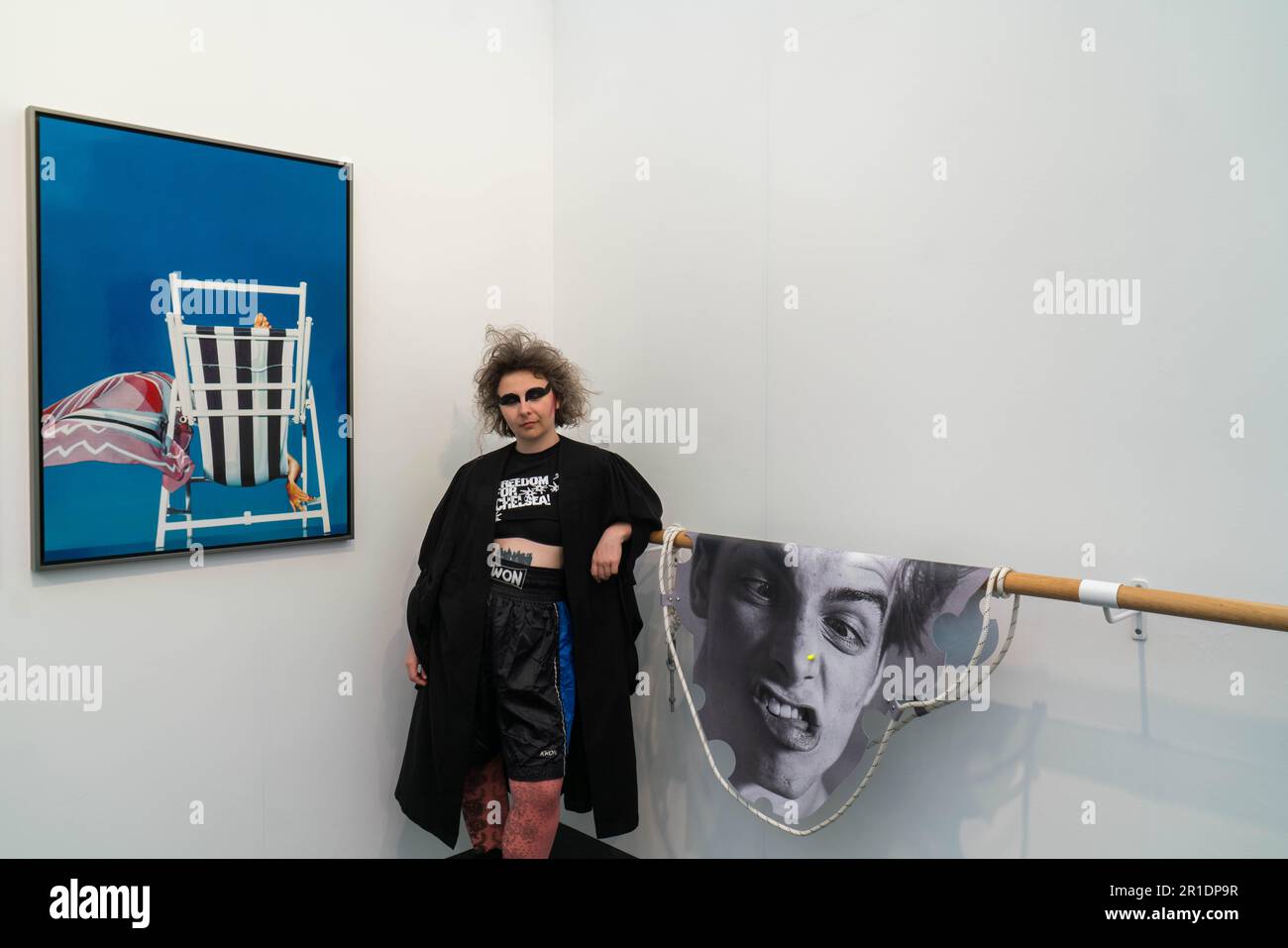 London UK. 13 May 2023. A visitor stands next to 'On The Nose' by ...
