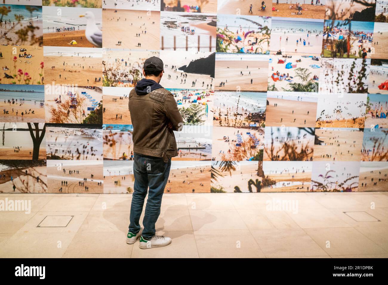 London UK. 13 May 2023. A visitor views seaside works by British ...