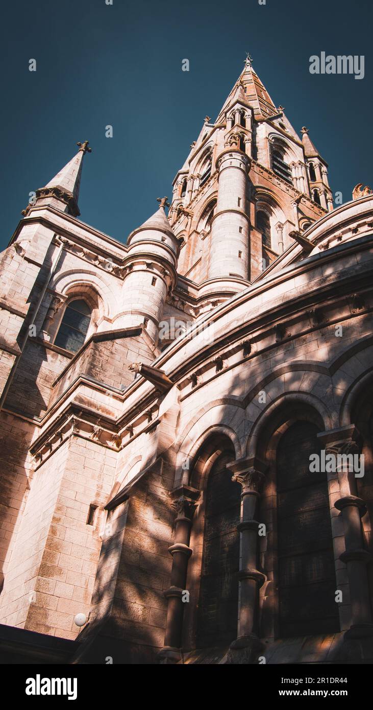 The tall spire of an Anglican church in Cork, Ireland. Neo-Gothic ...