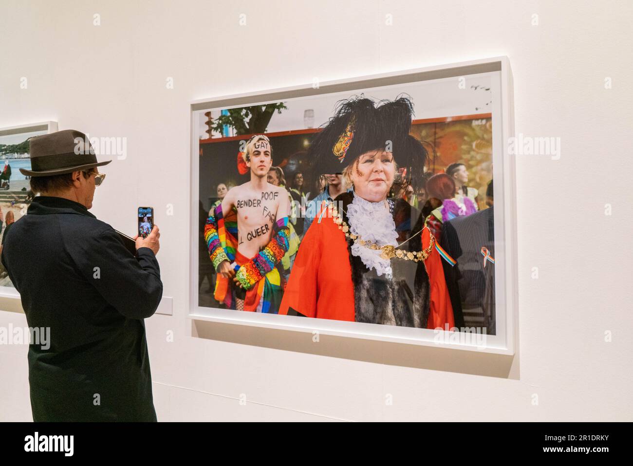 London UK. 13 May 2023. A visistor views works by British photographer ...