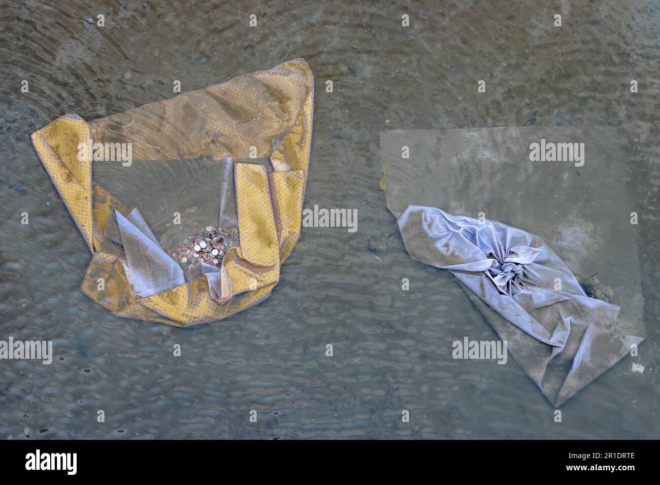 A decoration fabric with coins on a seabed in the mouth of the Chao ...
