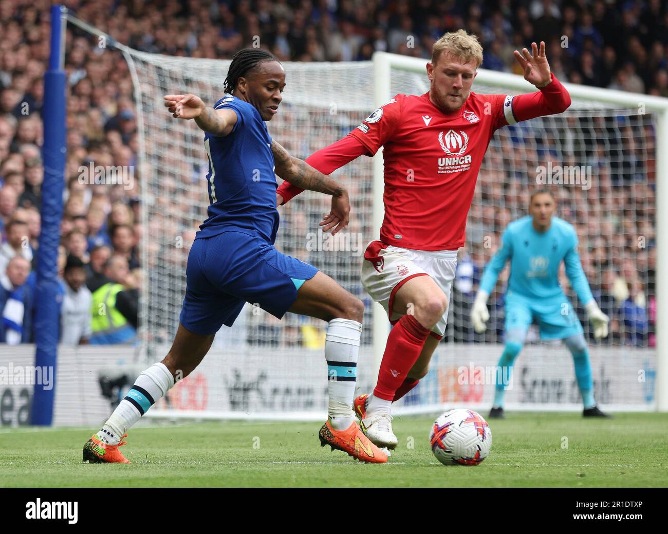 London, UK. 13th May, 2023. Raheem Sterling of Chelsea and Joe Worrall ...