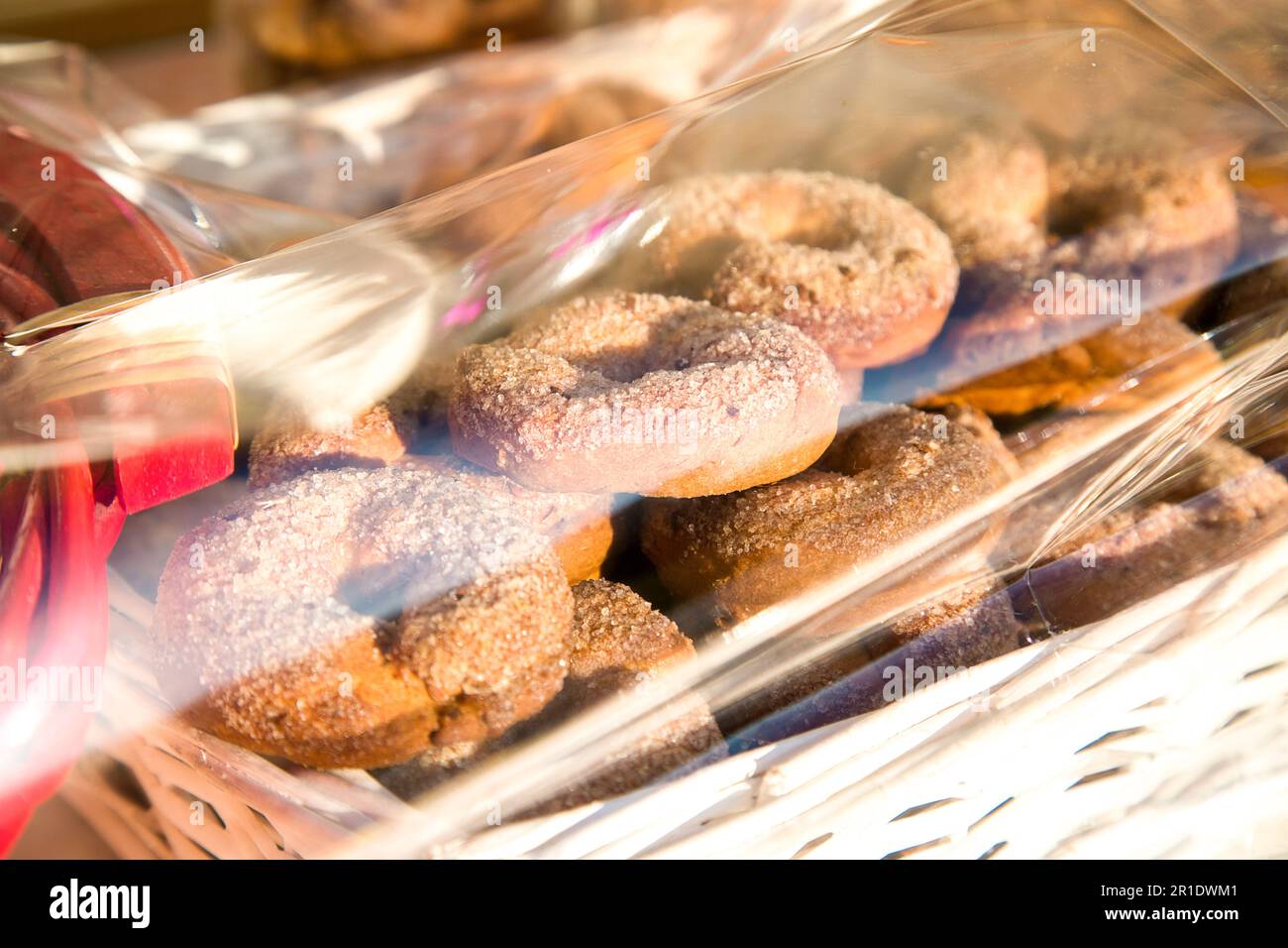 Homemade round biscuits ciambelli with sugar on top packed in white ...