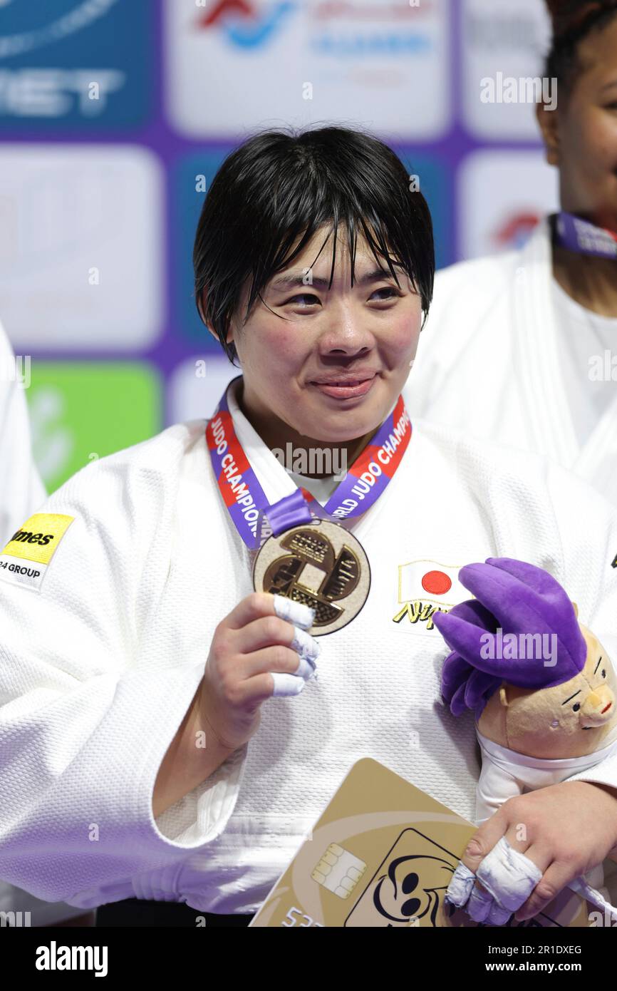 Japan's Akira Sone shows her gold medal during the awarding ceremony of the women's +78kg class ...