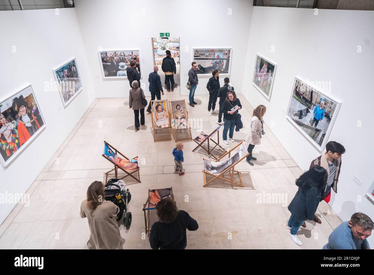 London UK. 13 May 2023. Visitors viewing works by British photographer ...