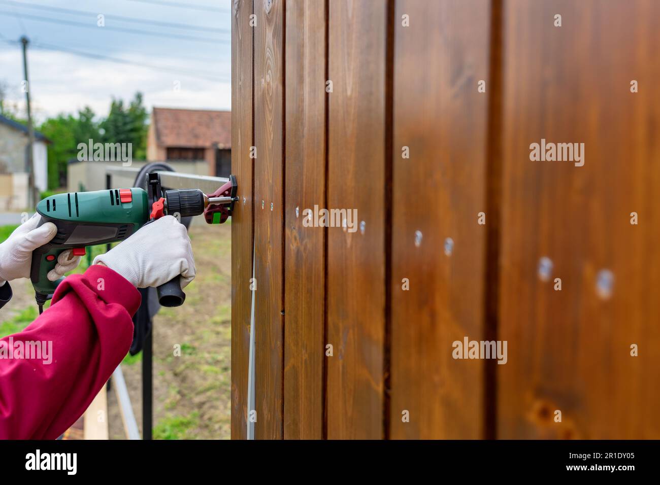 Man building fence man building fence hi-res stock photography and ...