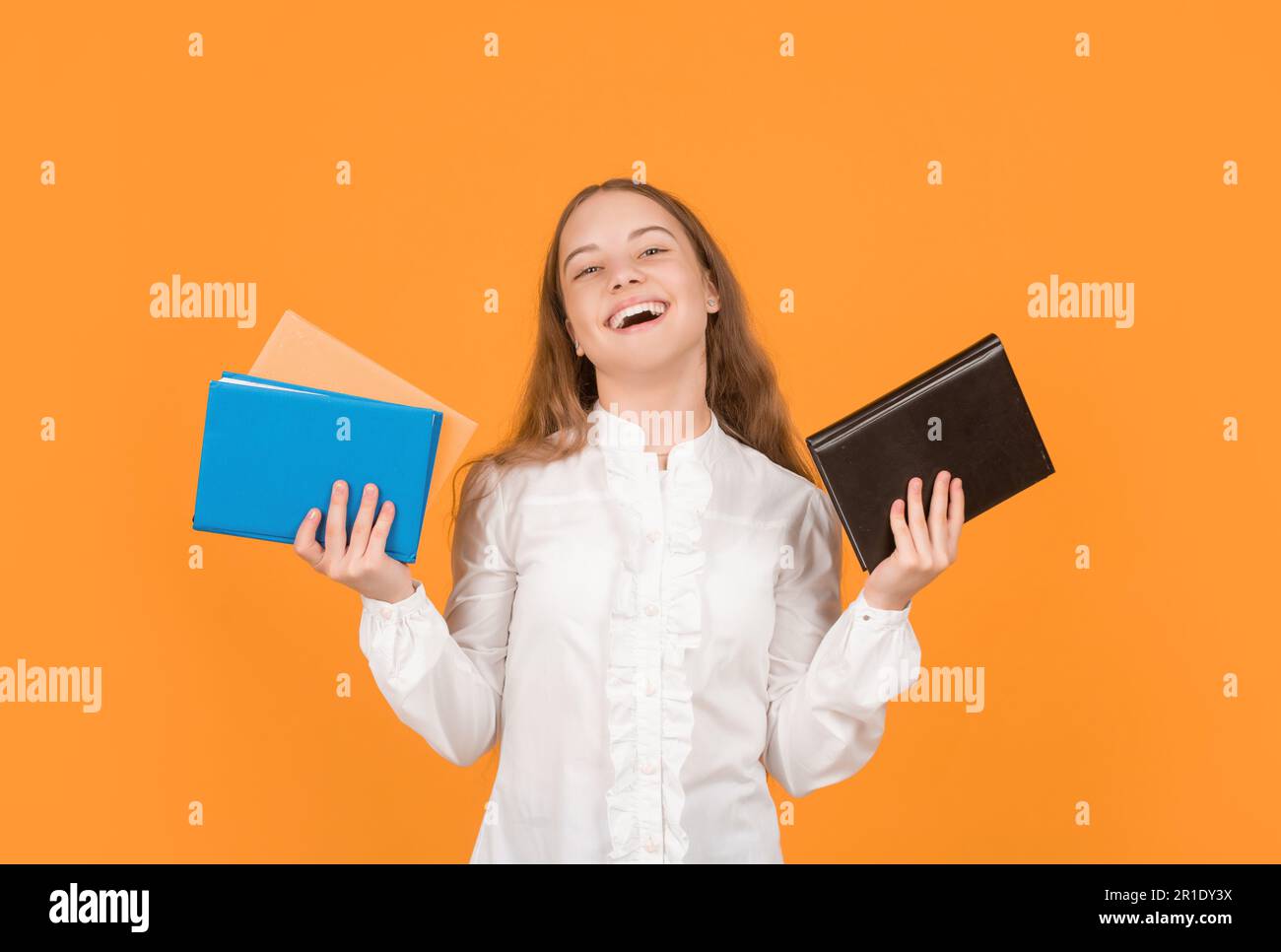 kid hold notebook. student in high school. teen girl do homework with ...