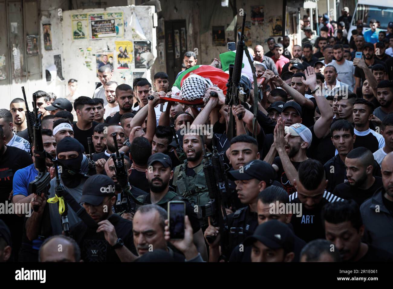Nablus, Palestinian Territories. 13th May, 2023. Mourners carry the ...