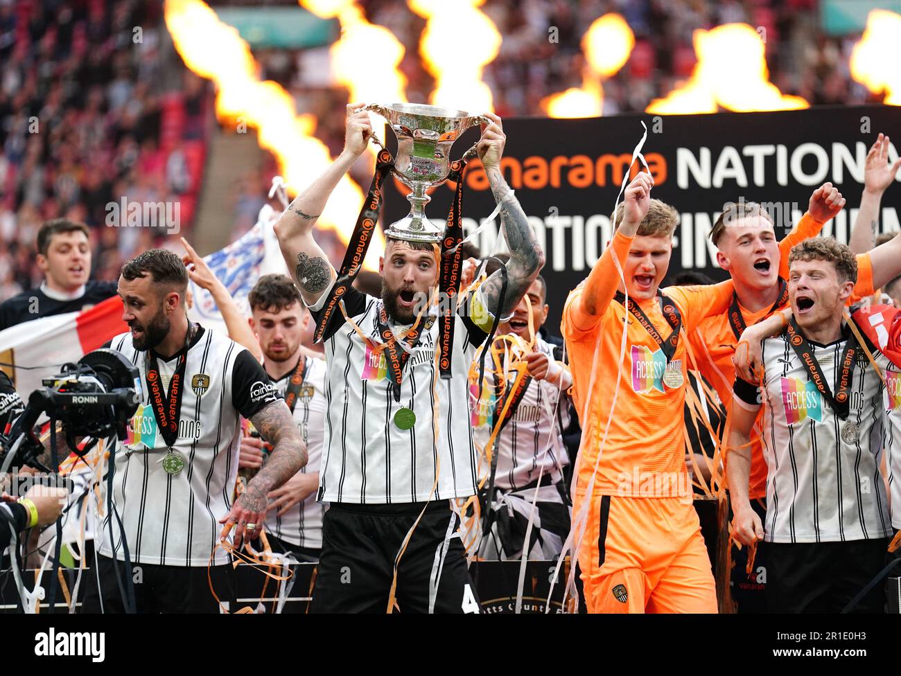 Notts County players celebrate promotion to the Sky Bet League Two with ...