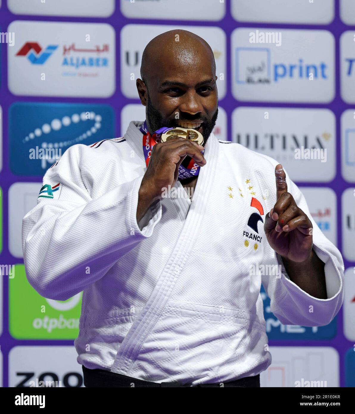 France's Teddy Riner shows his gold medal during the awarding ceremony of the men's +100kg class ...