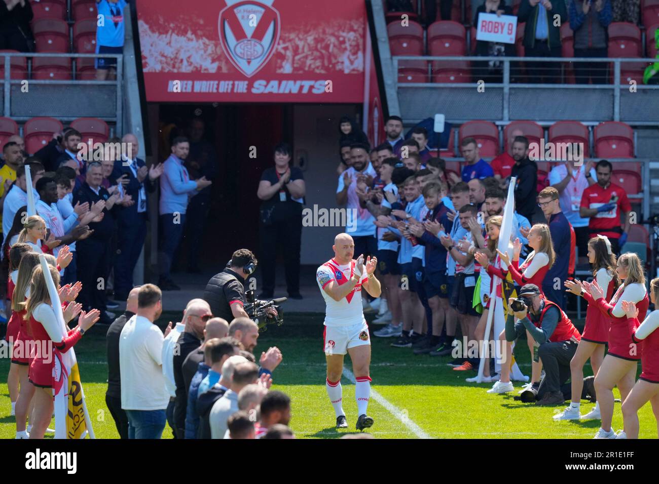 St Helens, UK. 13th May, 2023. James Roby #9 of St Helens is given a ...