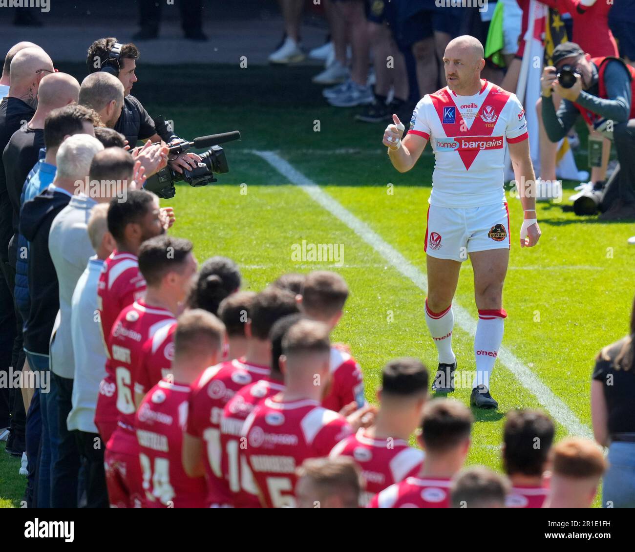 St Helens, UK. 13th May, 2023. James Roby #9 of St Helens is given a ...