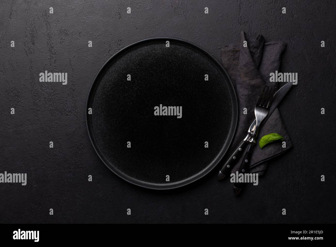 Top-down view of an empty plate and silverware mockup, perfect for ...