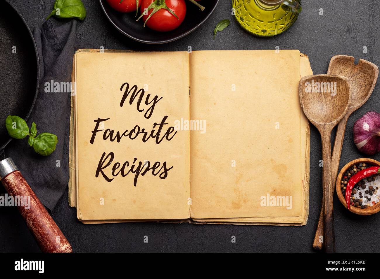 Top-down view of a kitchen table with ingredients, utensils, and an ...