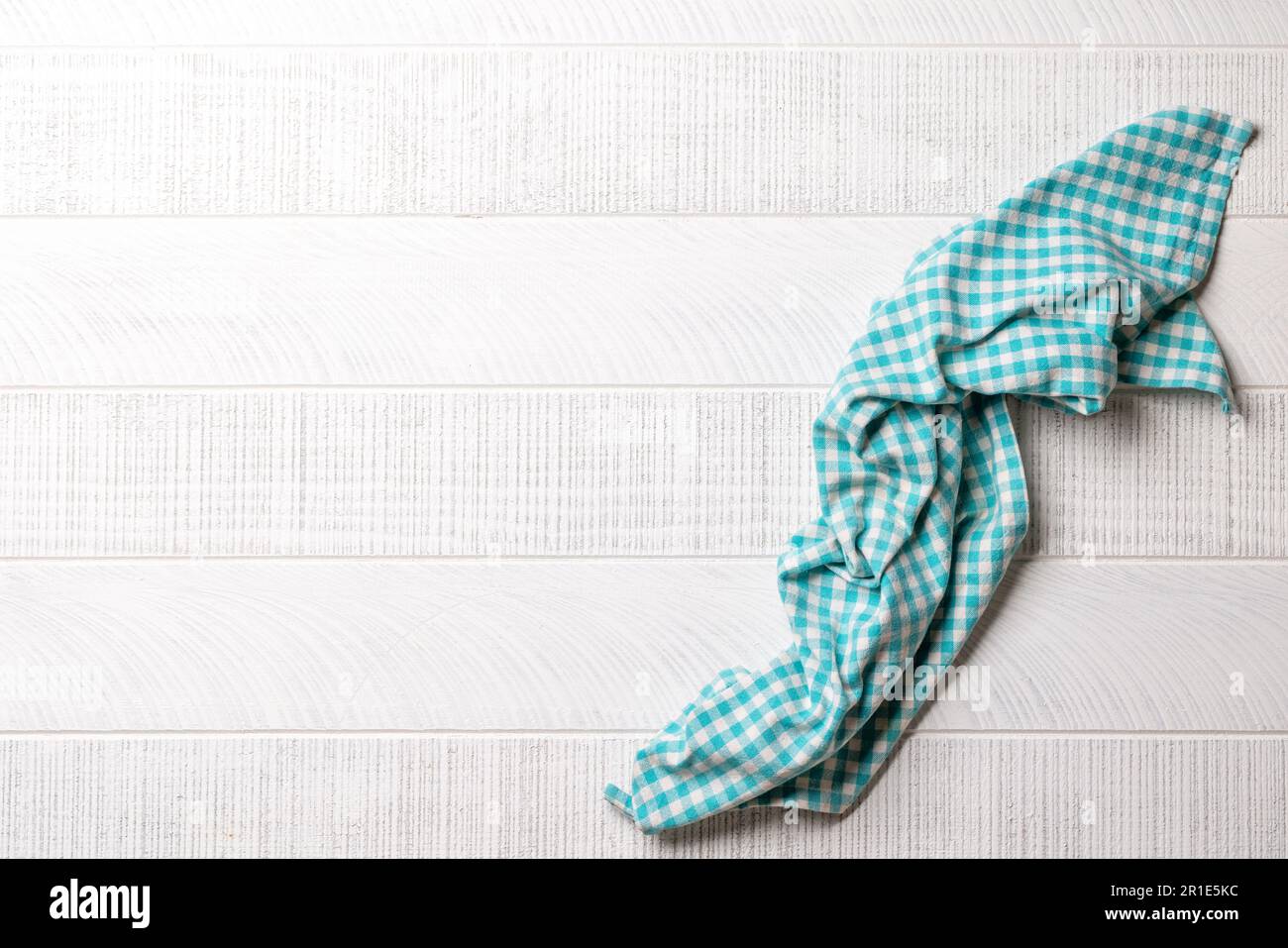 Top-down view of a kitchen table with a towel or napkin, creating a ...