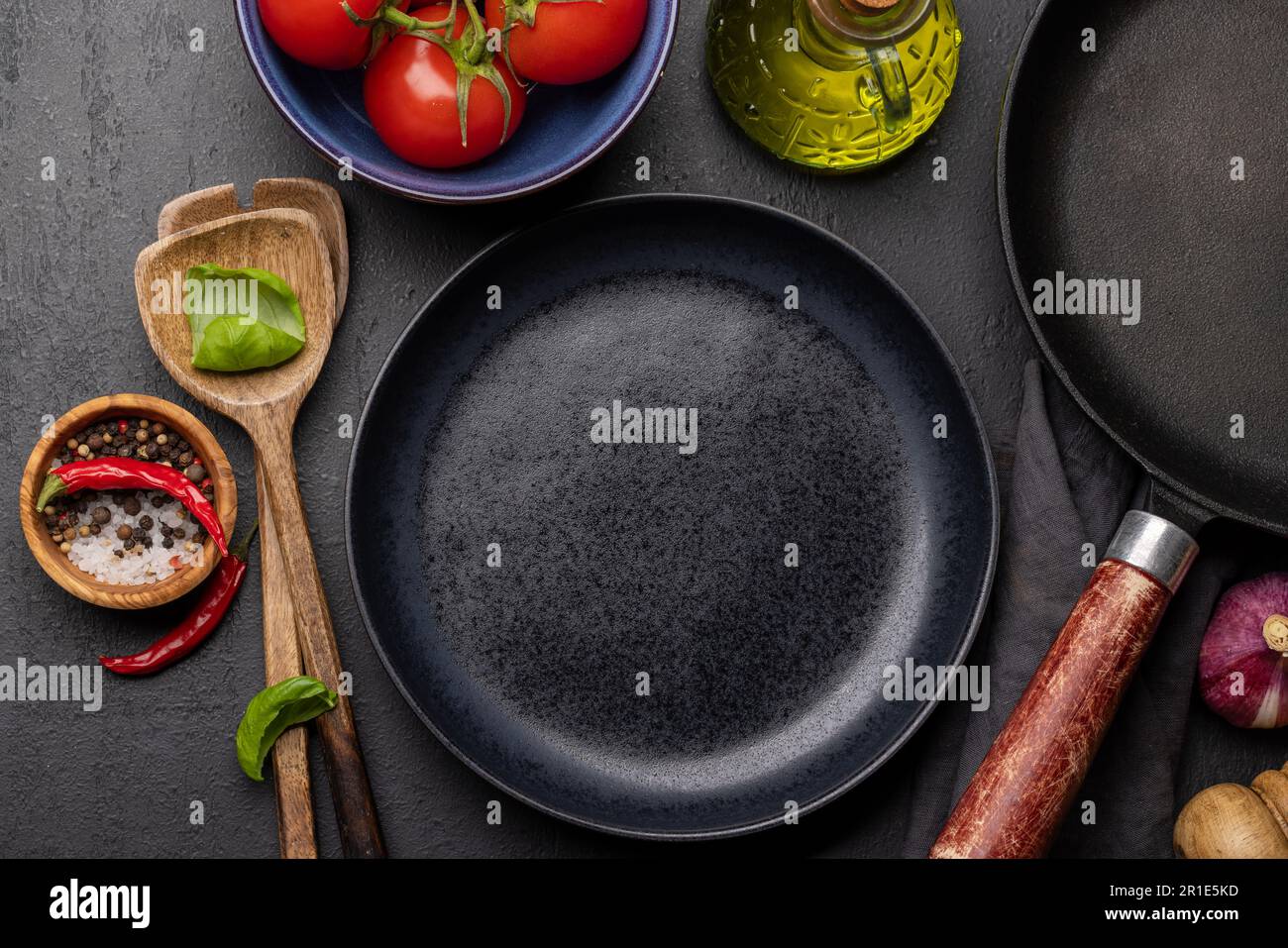 Top-down view of an empty plate mockup with food and kitchen utensils ...