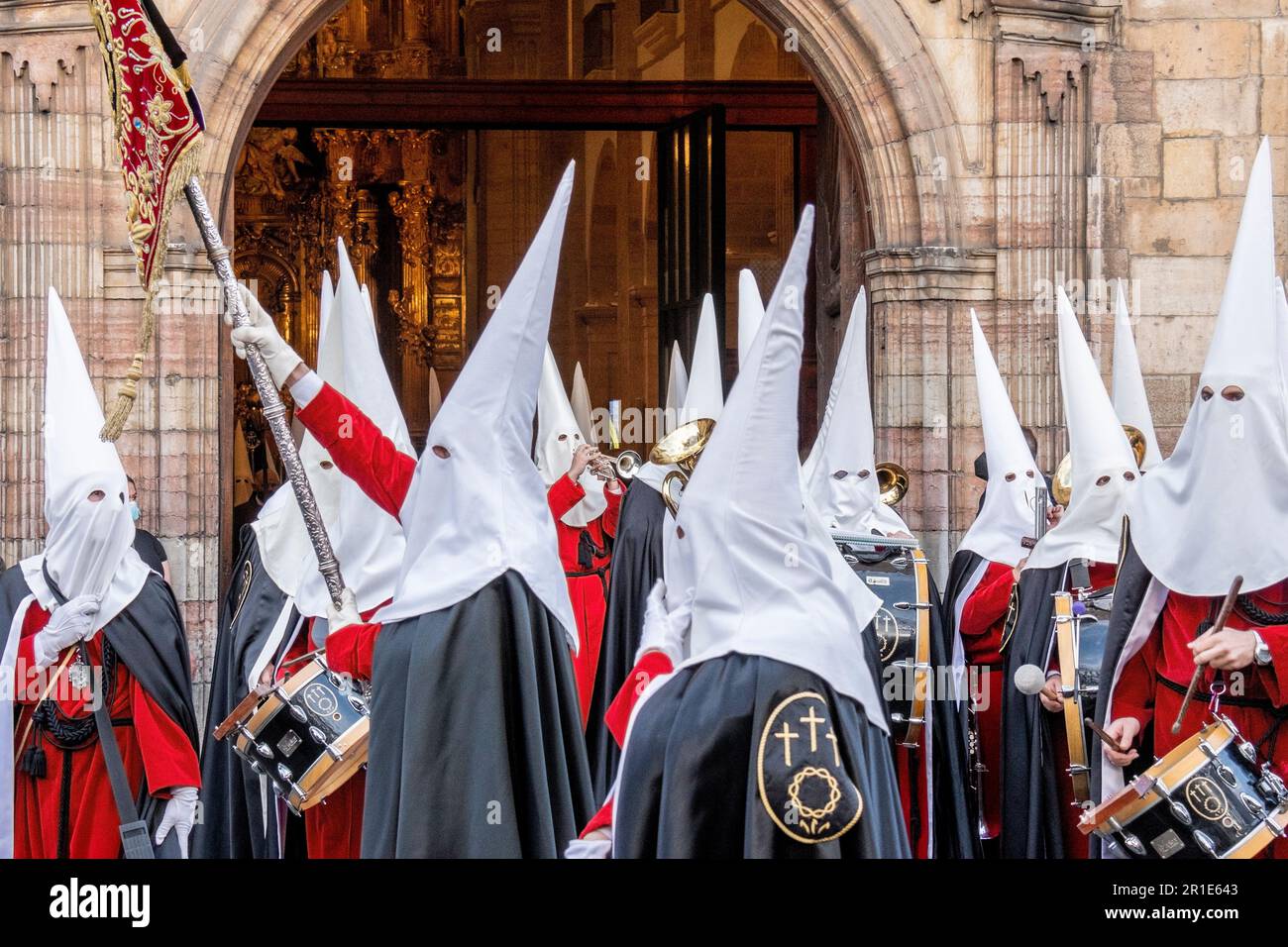 Members of a Cofradia wear Capirotes during a Semana Santa procession ...