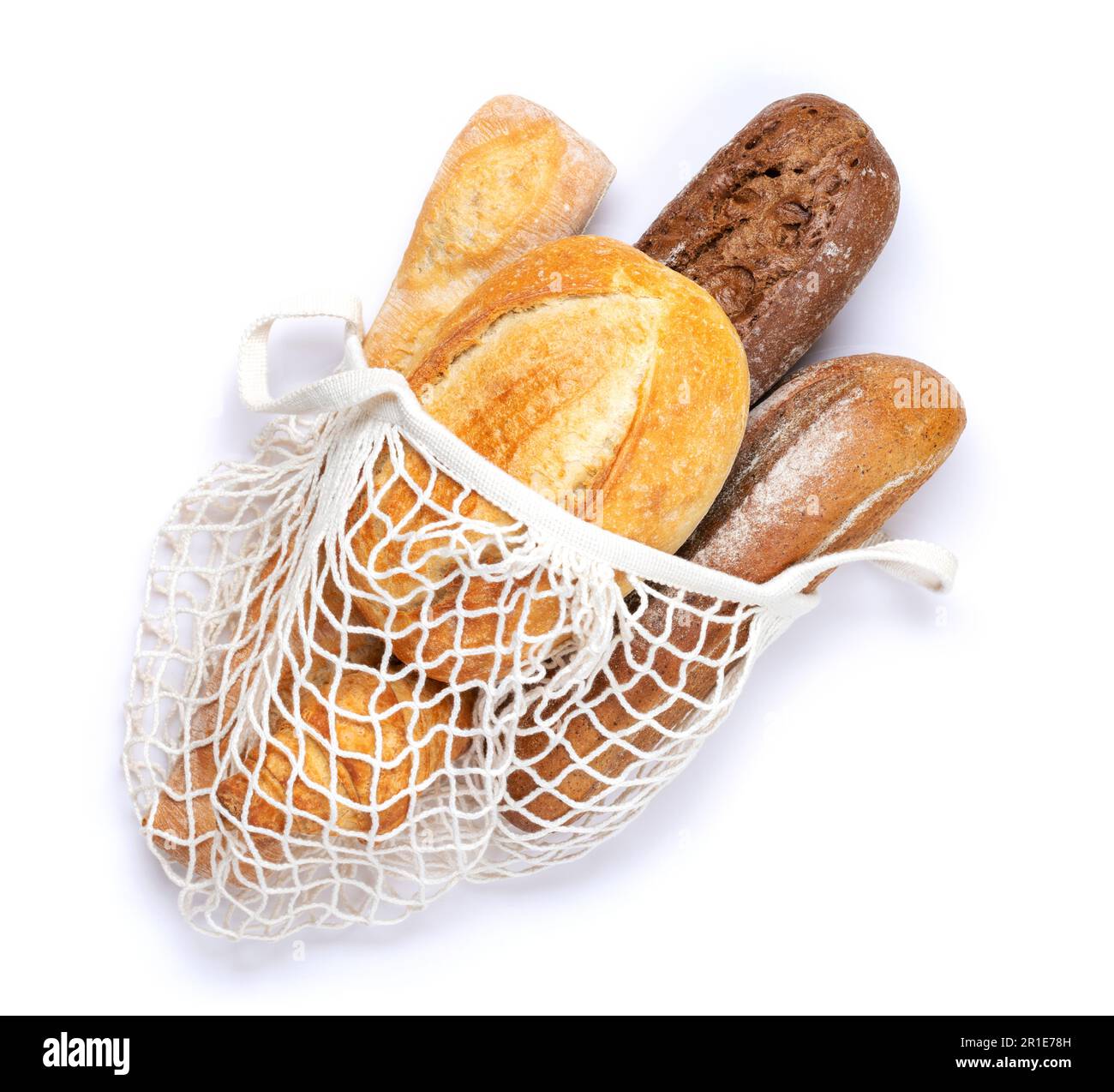 Fresh baked bread in mesh bag. Isolated on white background. Flat lay ...