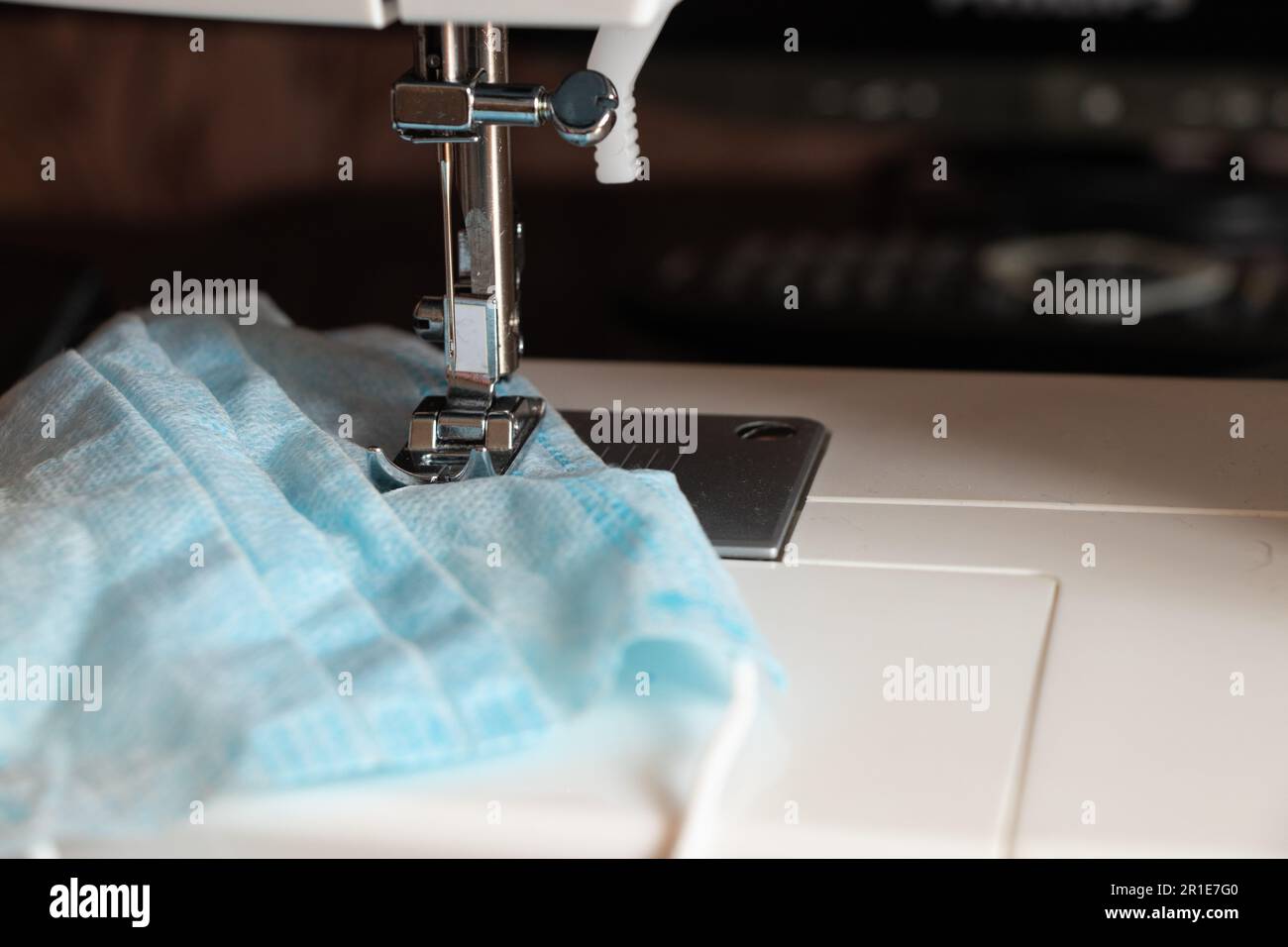 new sewing machine sews a medical mask close-up during Stock Photo - Alamy