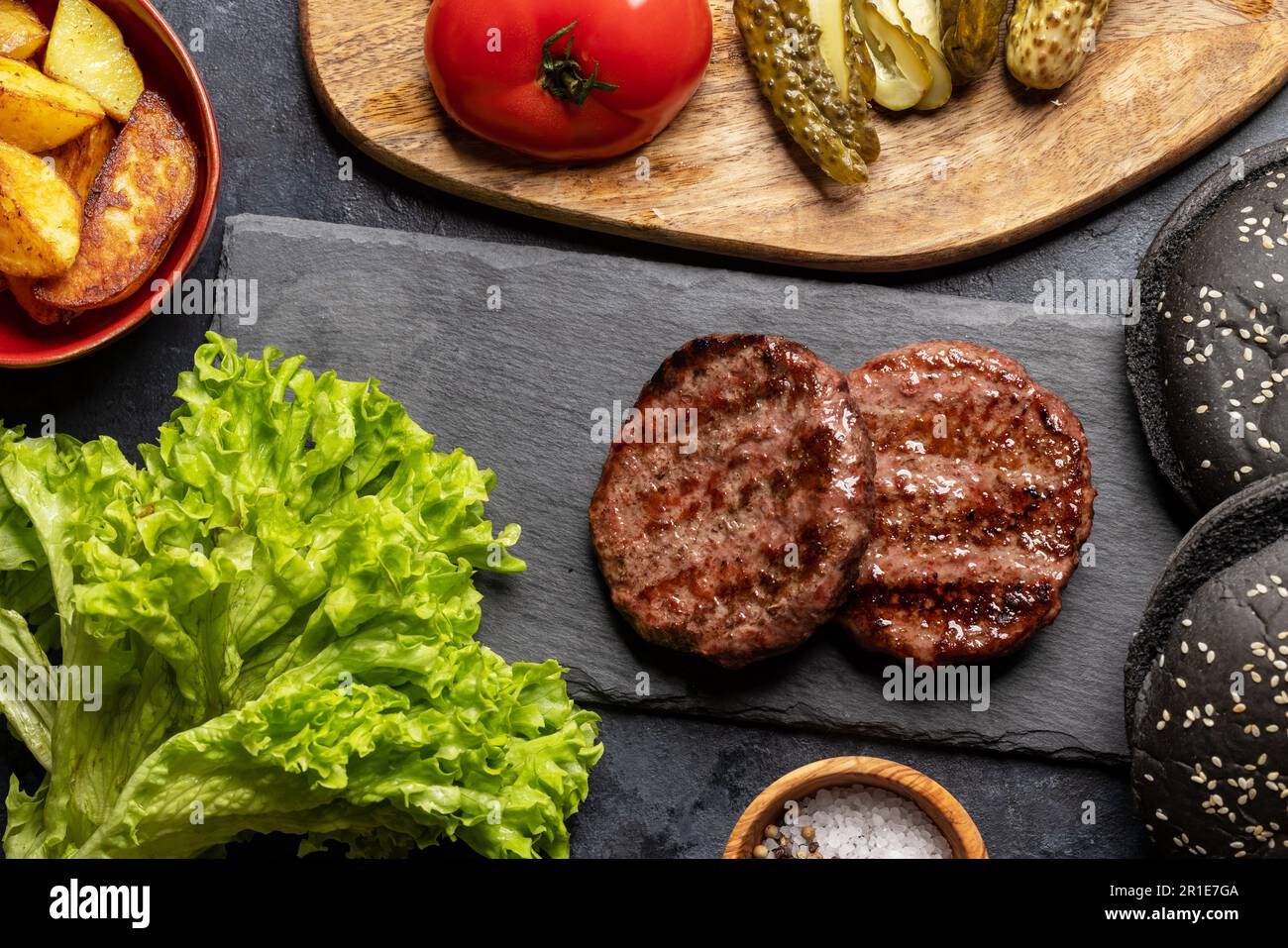 Homemade beef burgers cooking and ingredients. Flat lay Stock Photo - Alamy
