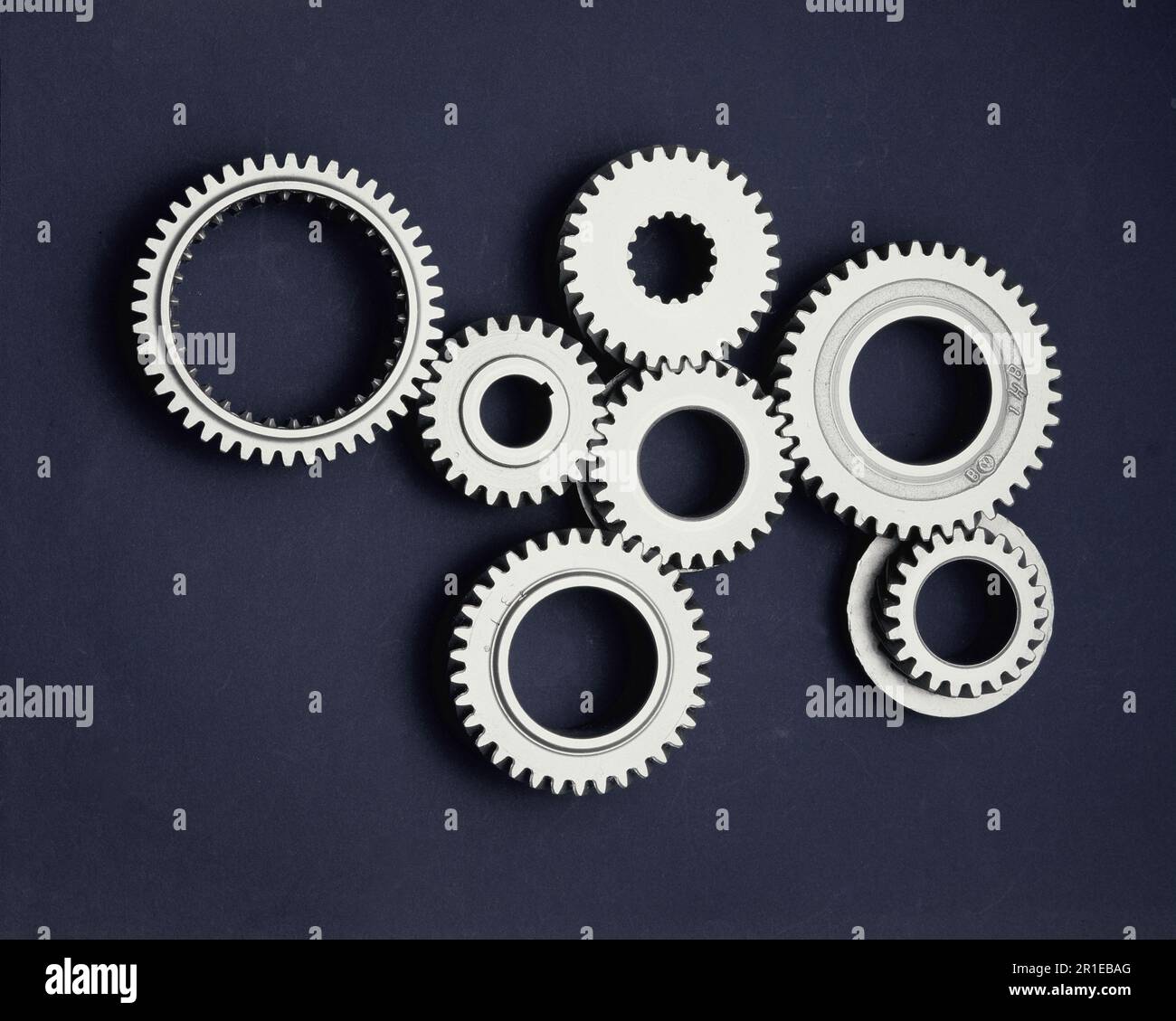 Metal cogs interacting with each other Stock Photo - Alamy