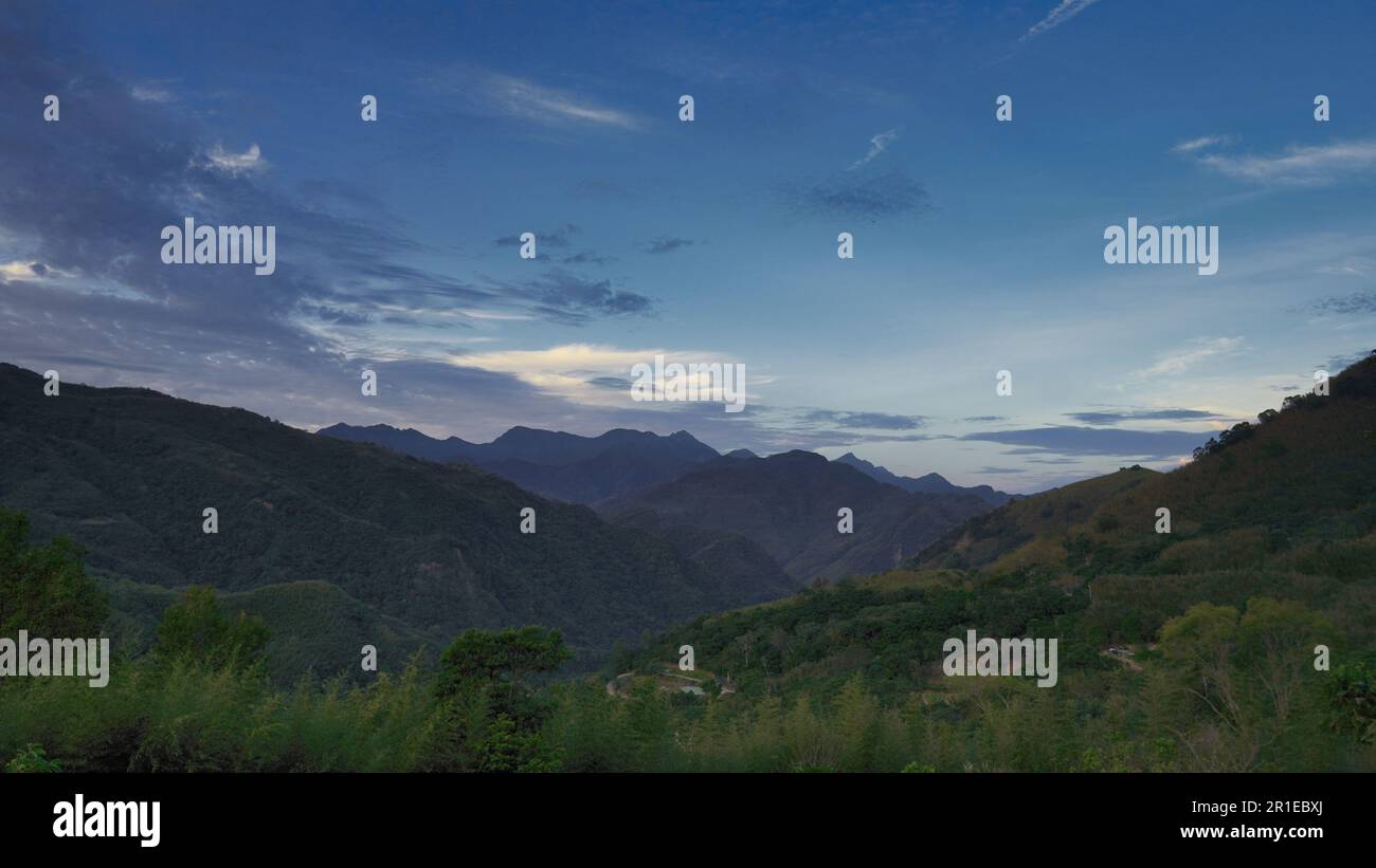 A breathtaking view of a distant mountain range, featuring dramatic ...