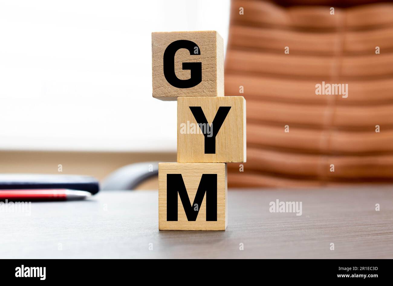 Alphabet letter block in word gym on wood background Stock Photo - Alamy