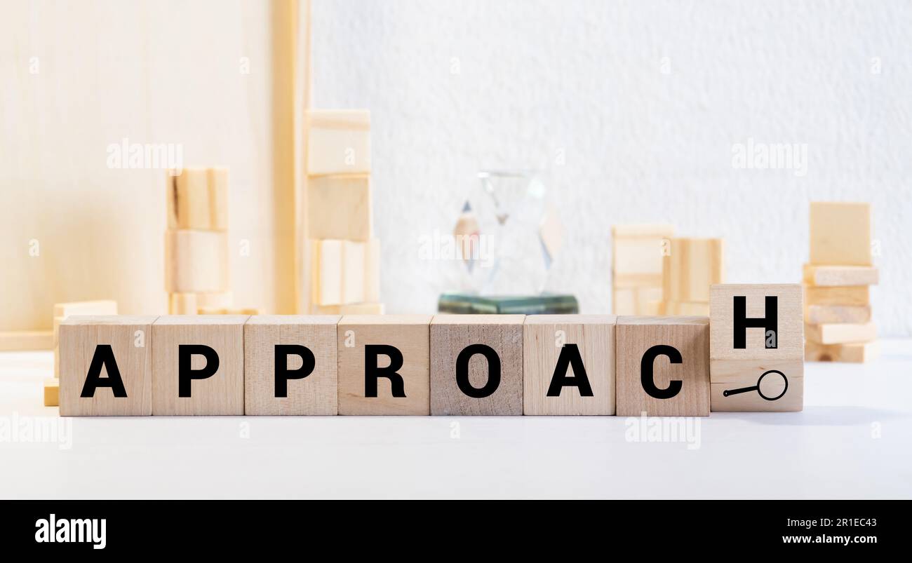 APPROACH word written on wood block. APPROACH text on cement table for ...