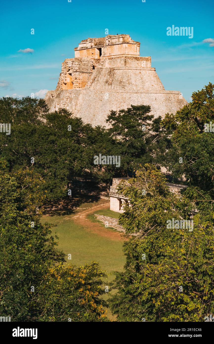 the Pyramid of the Magician towers over the ruins of Uxmal, an ancient ...