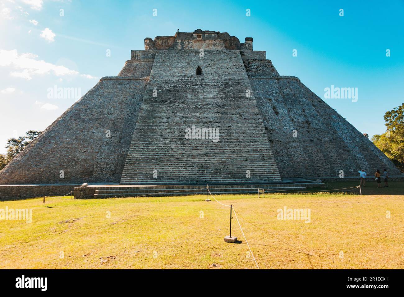 the Pyramid of the Magician towers over the ruins of Uxmal, an ancient ...